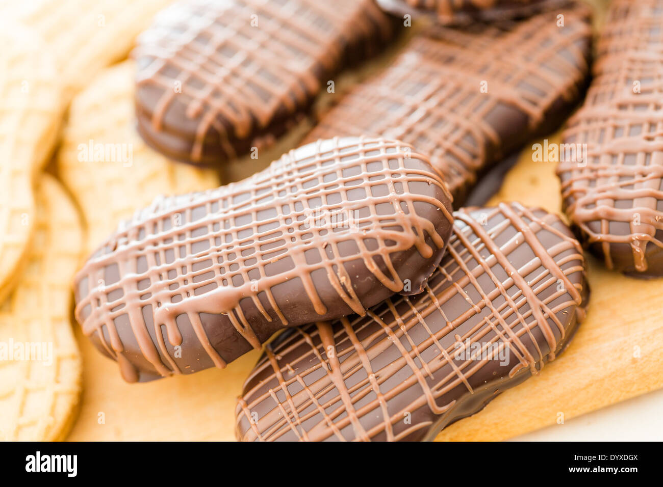 Gourmet Chocolate covered Nutter Butters with chocolate design on top ...