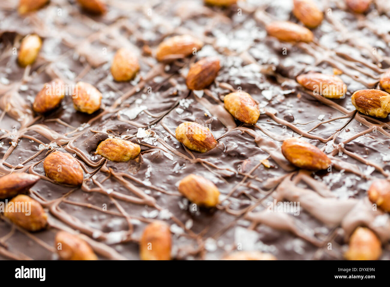 Gourmet slab of Almond Bark on a white background Stock Photo - Alamy