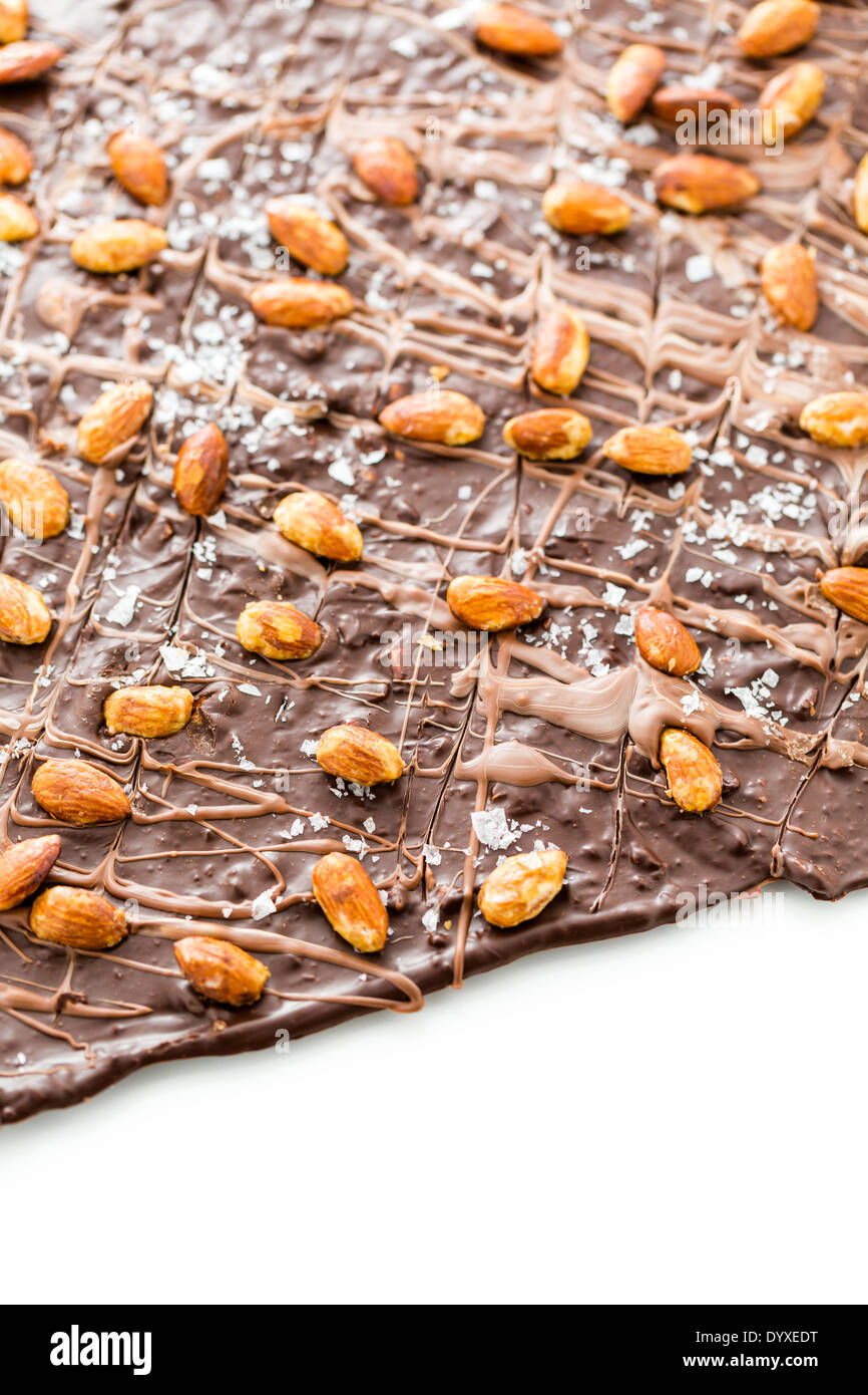 Gourmet slab of Almond Bark on a white background Stock Photo - Alamy
