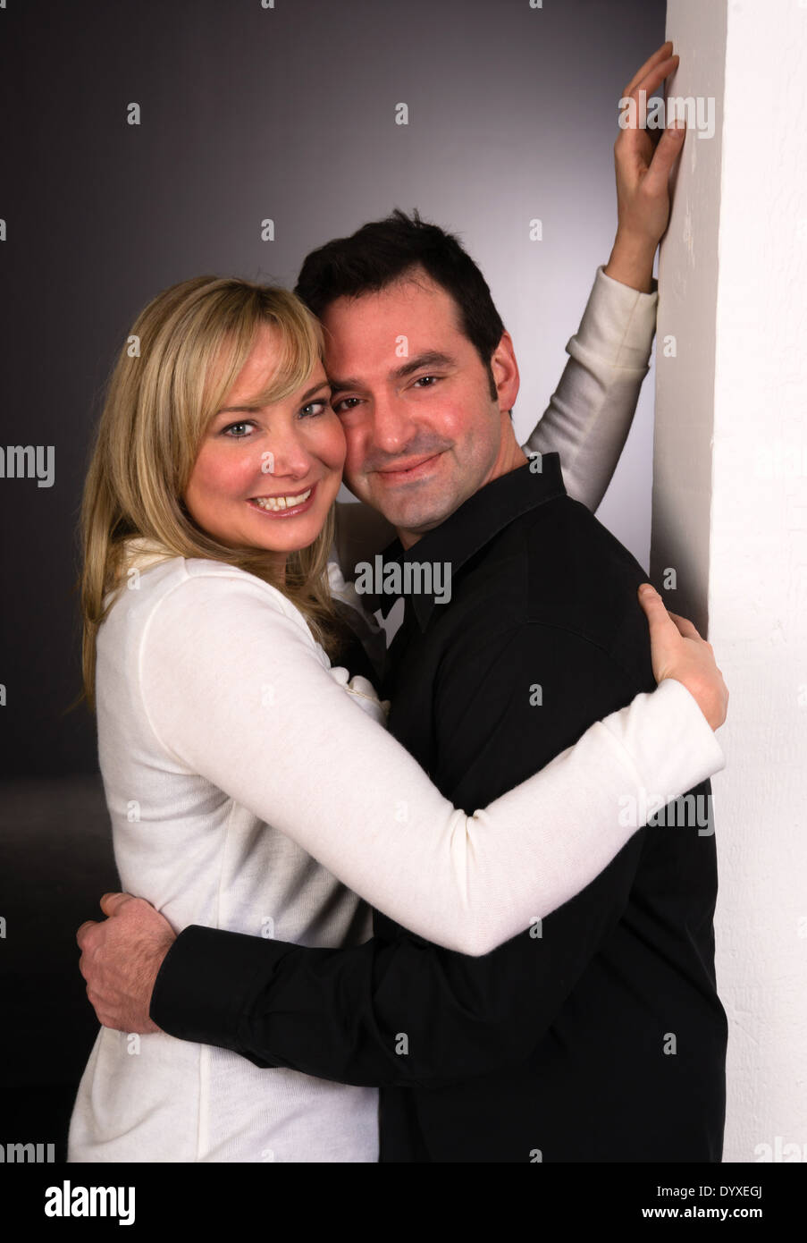 A recently engaged to be married couple shows thier love for each other ...