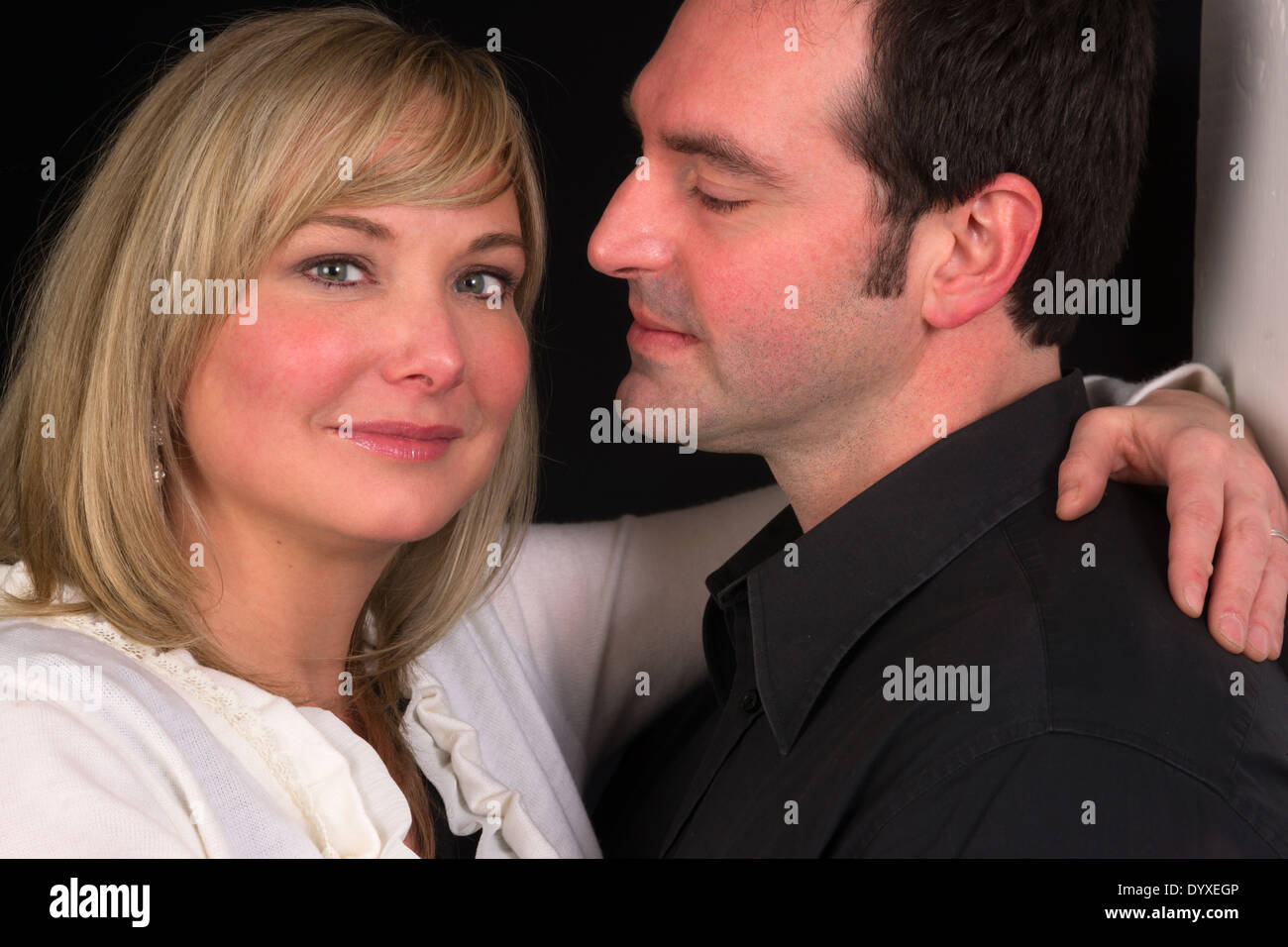 A recently engaged to be married couple shows thier love for each other ...