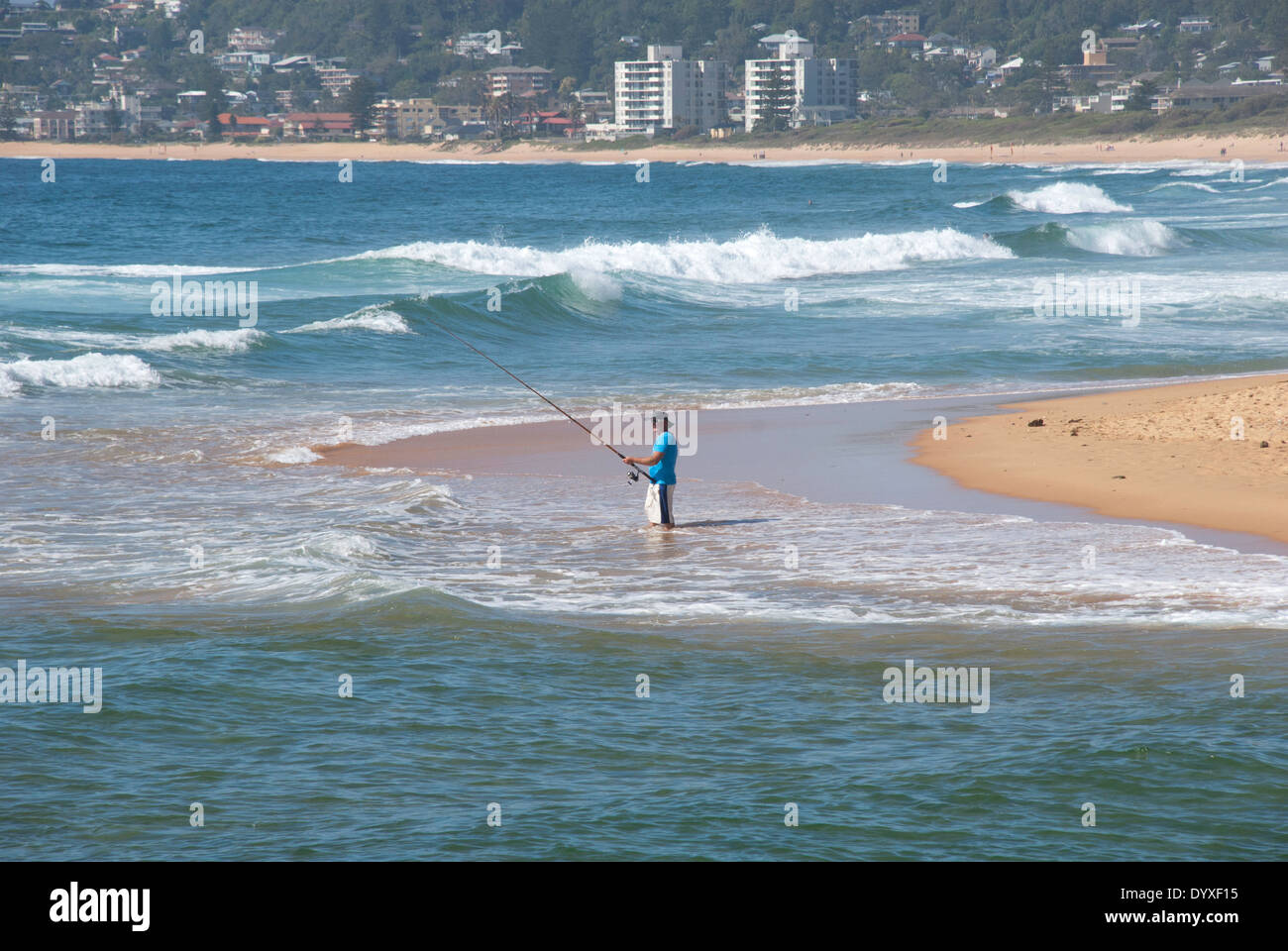 A man fishing at North Narrabeen beach Stock Photo - Alamy