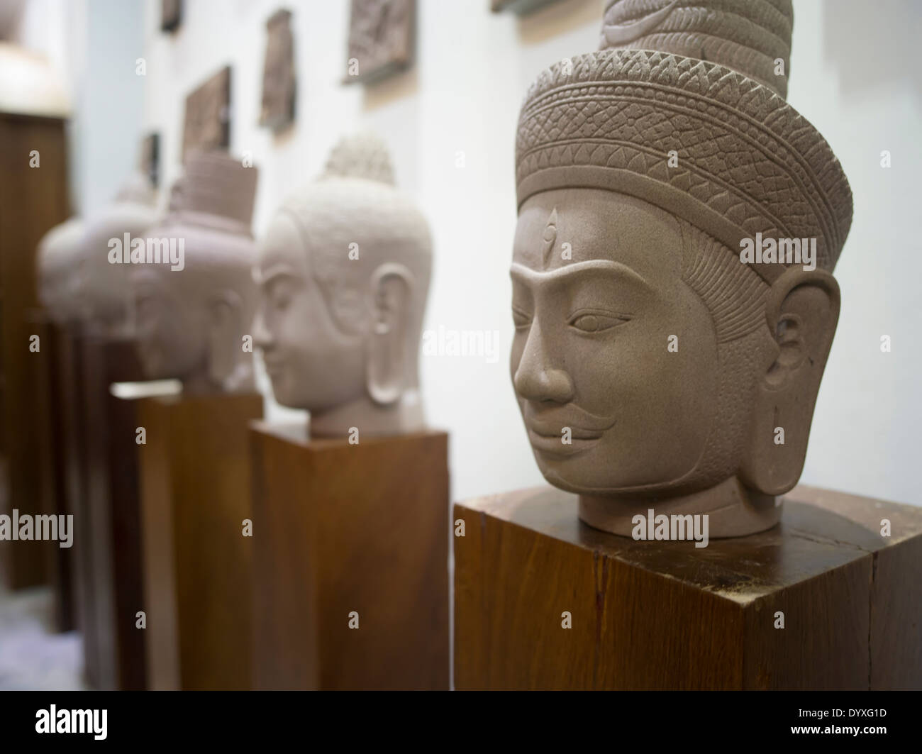Stone carvings of heads at angkor night market hi-res stock photography ...