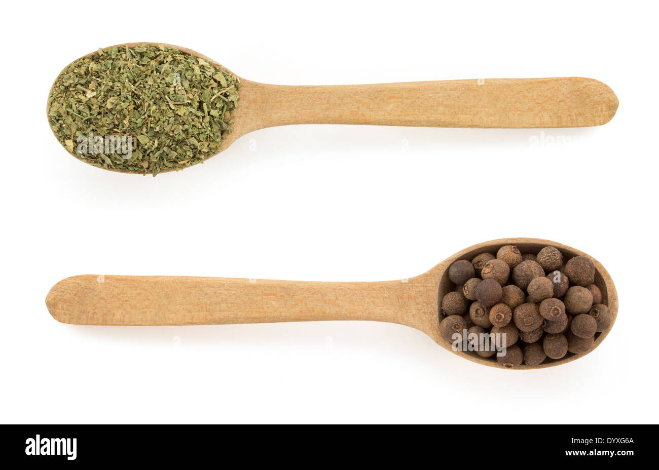 dried green spices in spoon isolated on white background Stock Photo ...