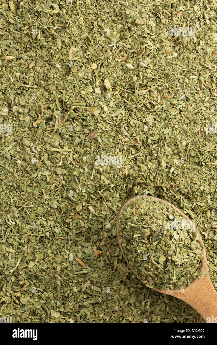 dried green spices in spoon as background Stock Photo - Alamy