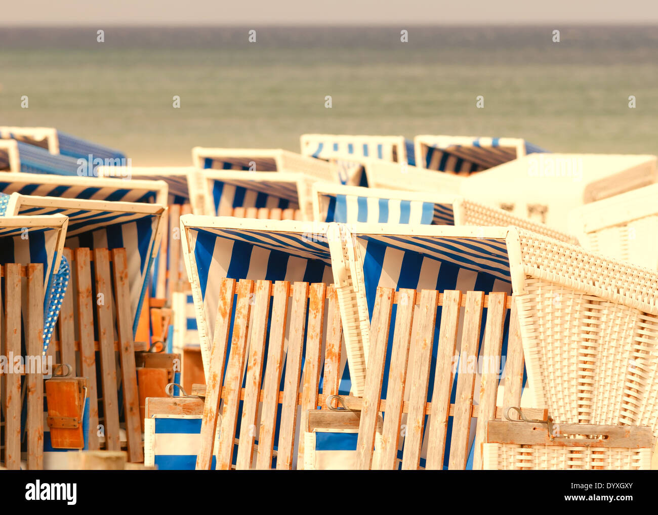 Detail of a bunch of traditionally wicker build beach chairs at the ...