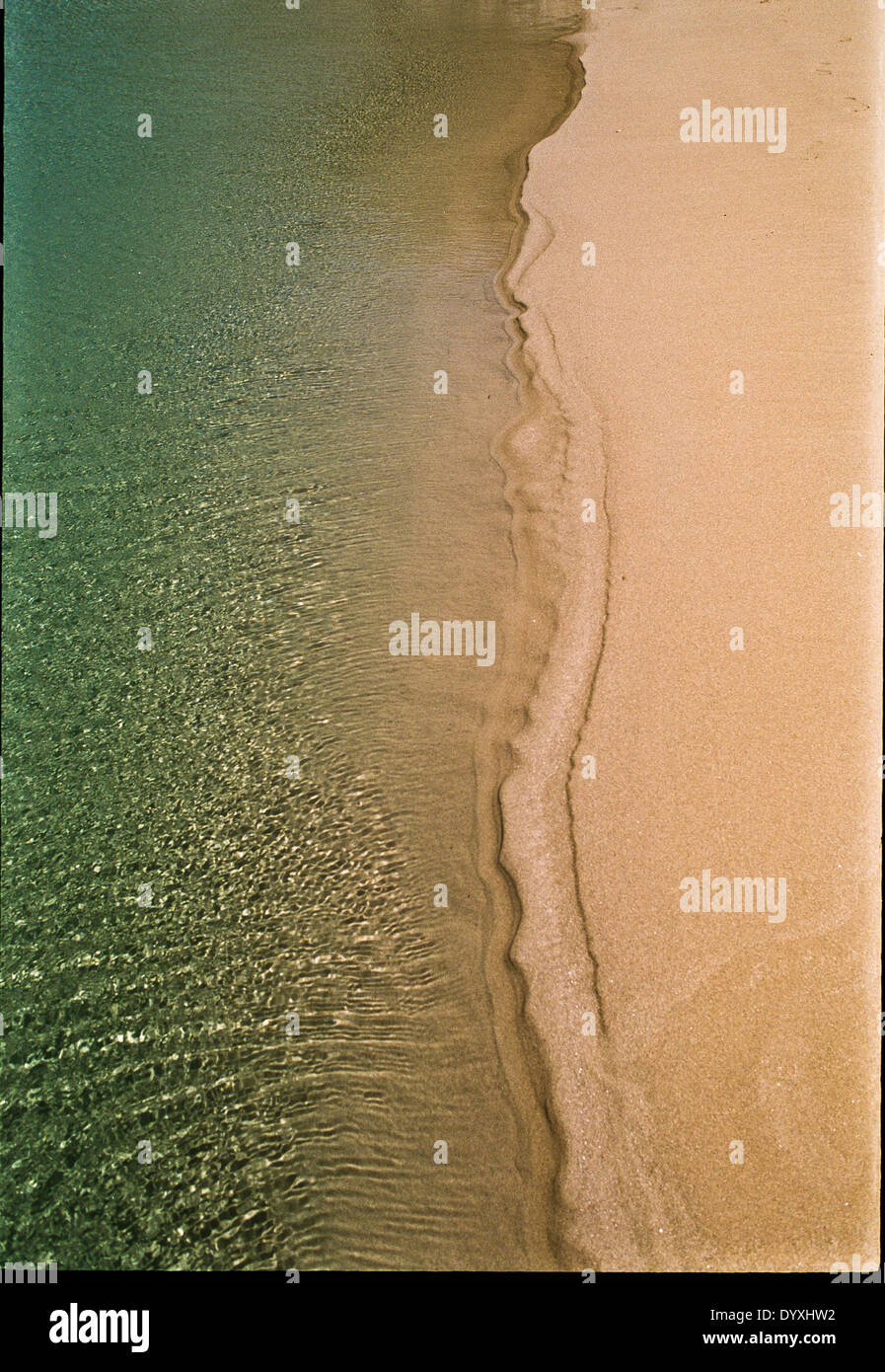 graphic overhead photo of the waters edge. gentle rippling water ...