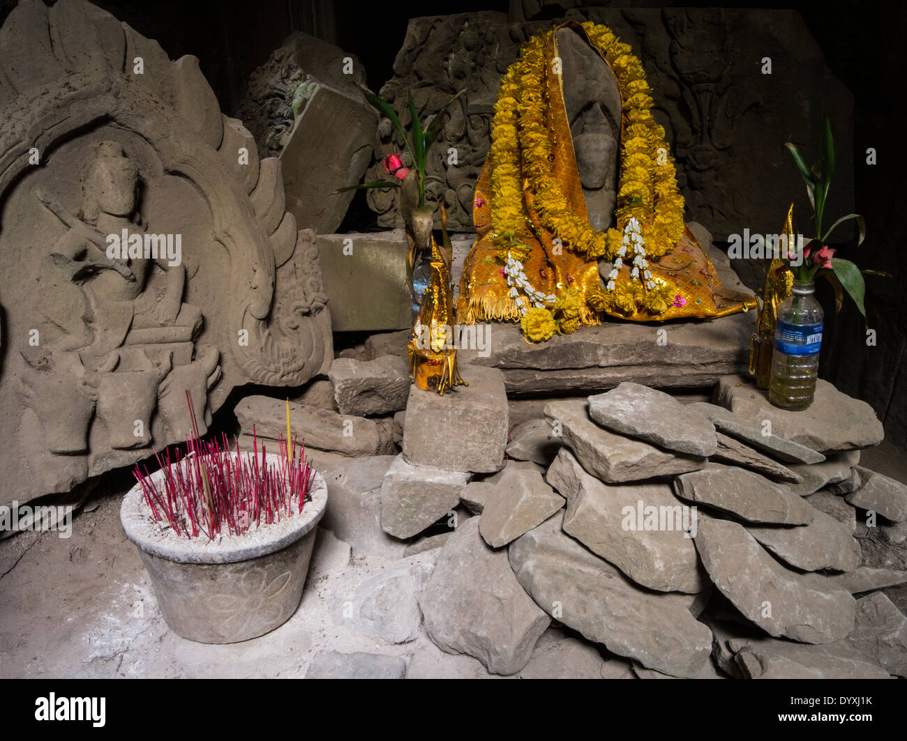 Buddhist statues inside Ta Prohm temple ruin in the forest. Siem Reap ...
