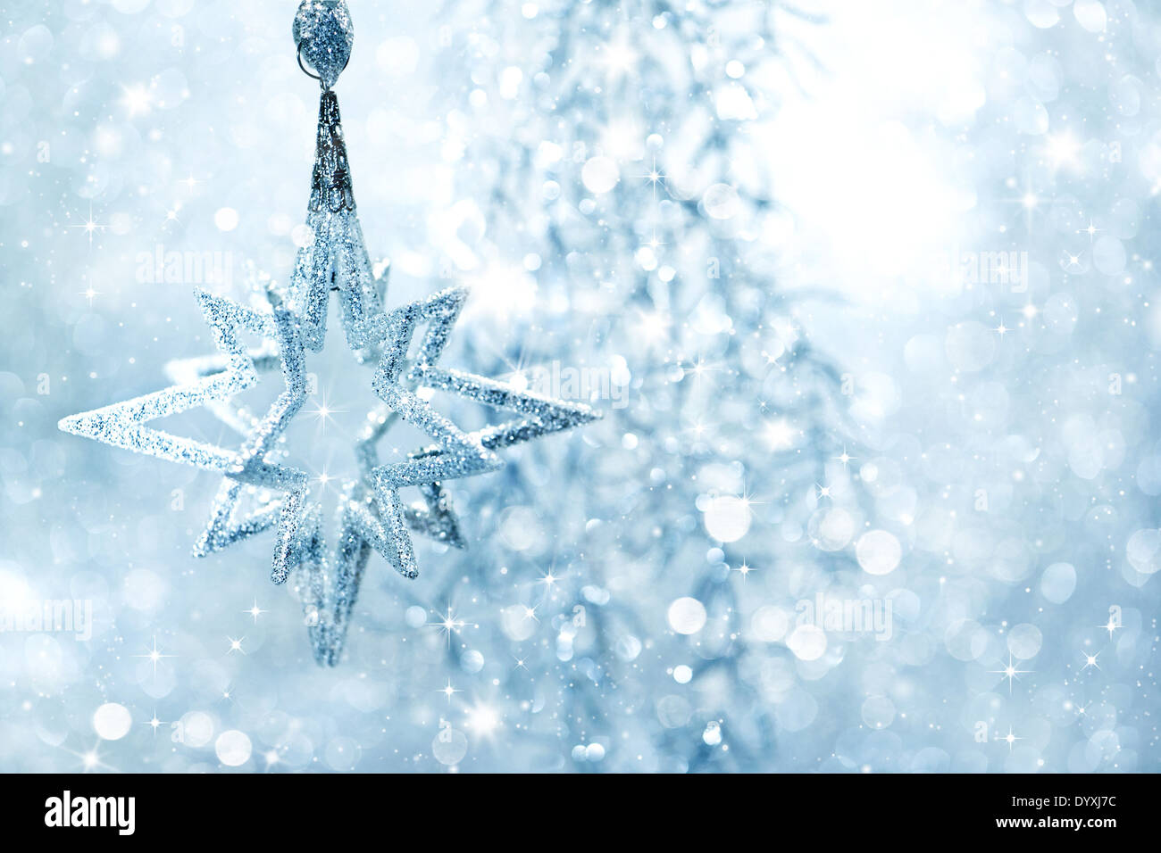 Winter blue background shiny silver star with blinking lights Stock ...