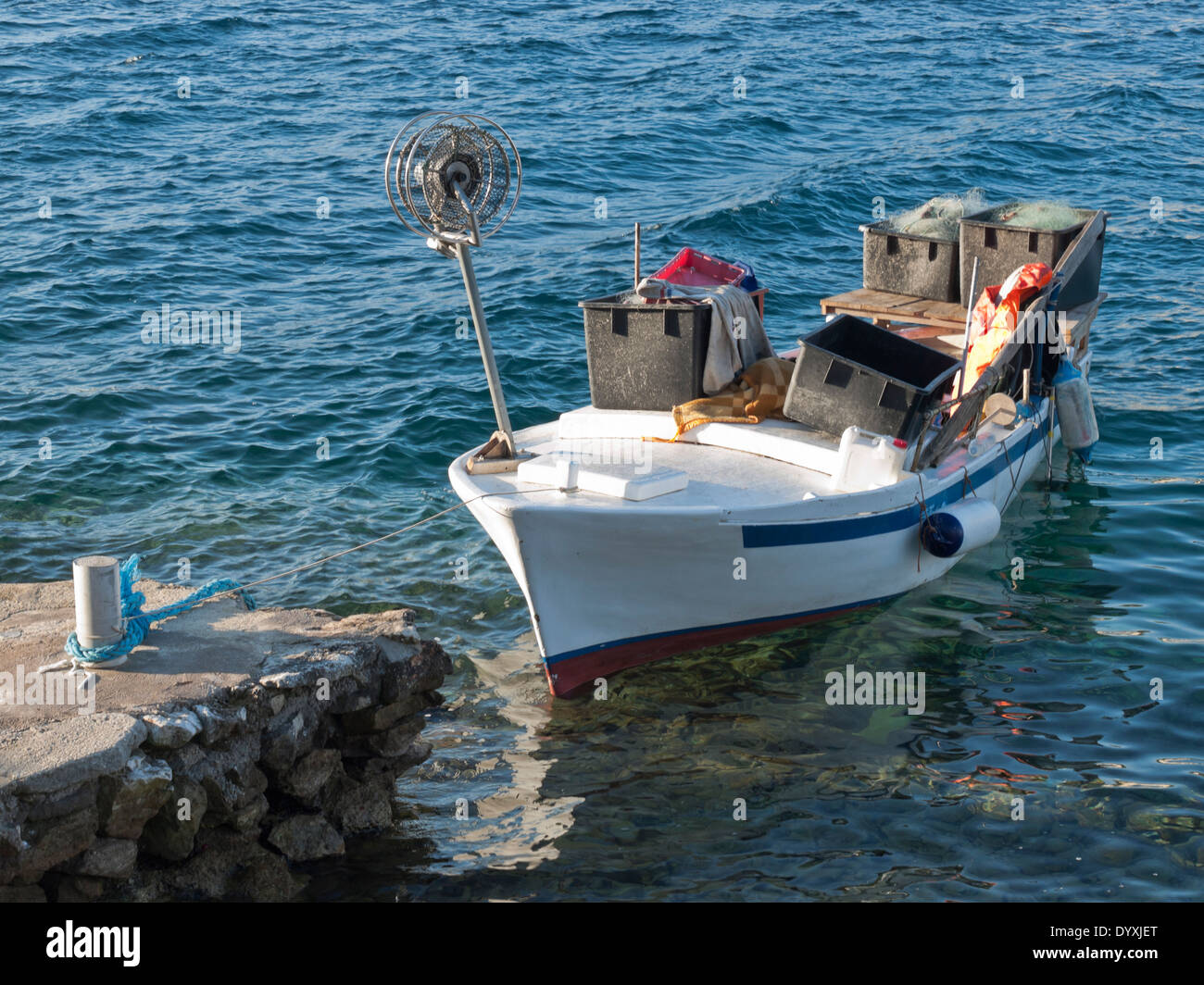 Anchored fishing boat in hi-res stock photography and images - Alamy