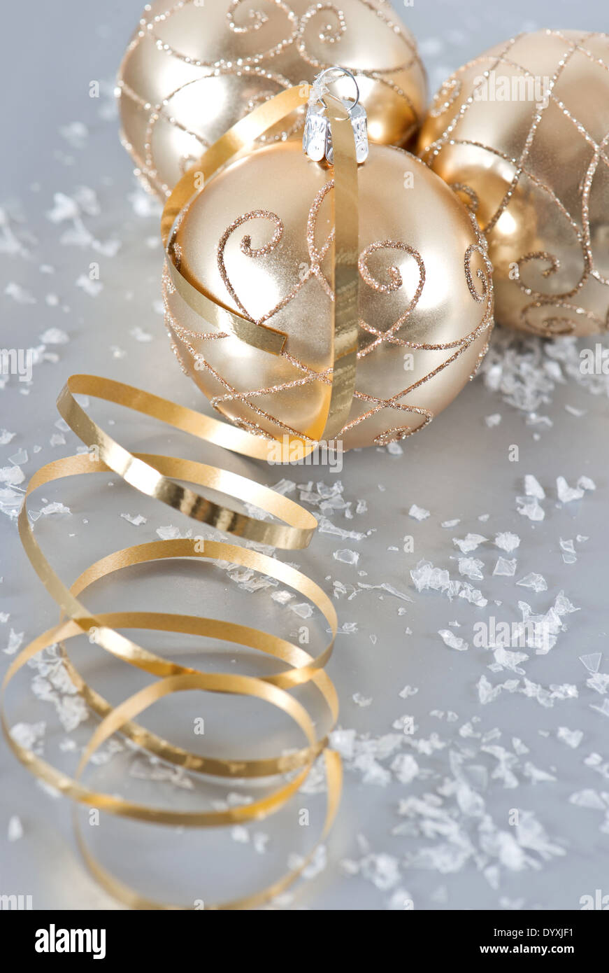 golden christmas balls with golden streamer and snow decoration Stock ...
