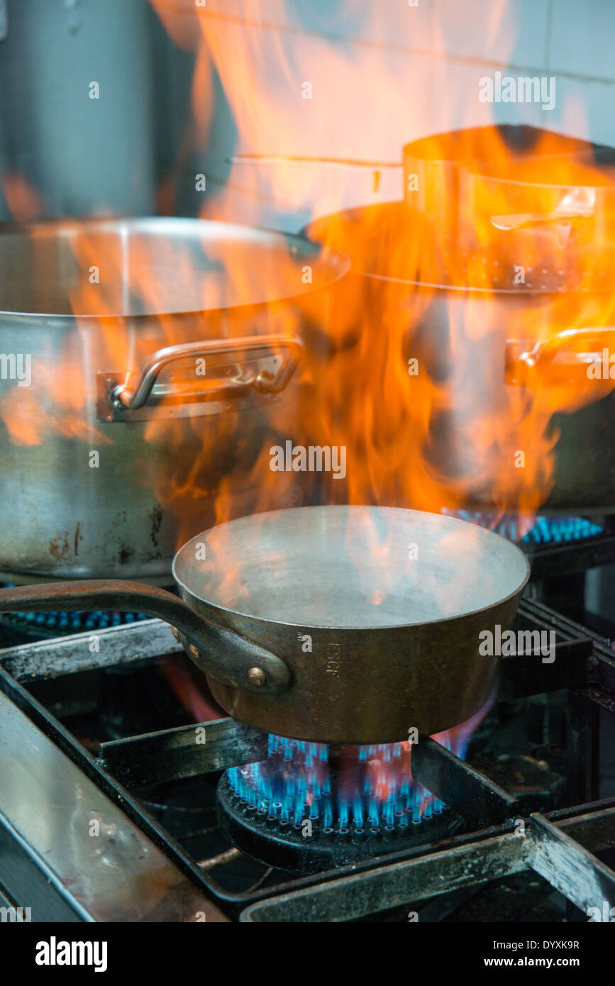 flambe cooking in a restaurant Stock Photo - Alamy
