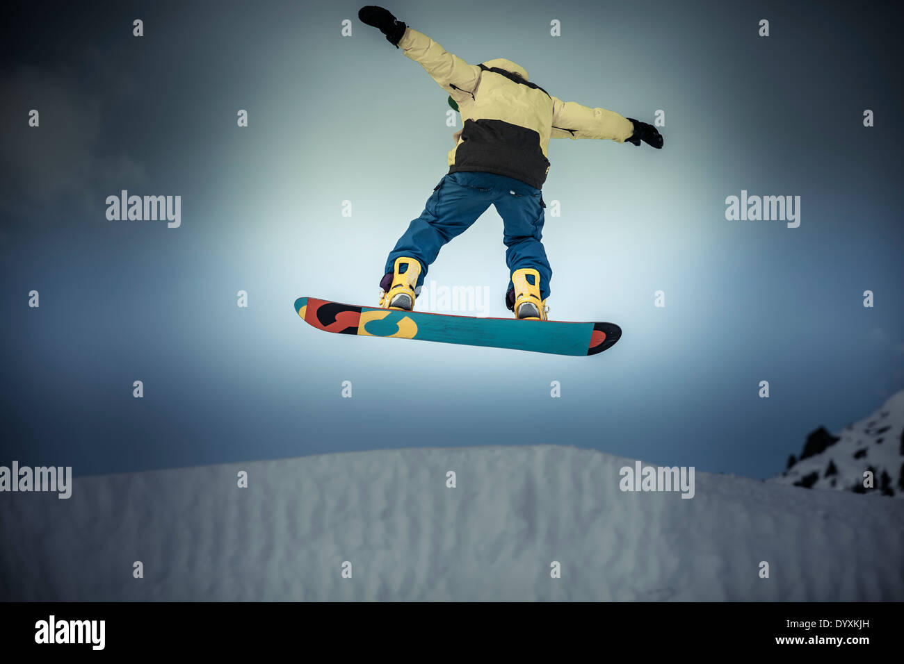 Snowboarder performs an aerial jump Stock Photo - Alamy