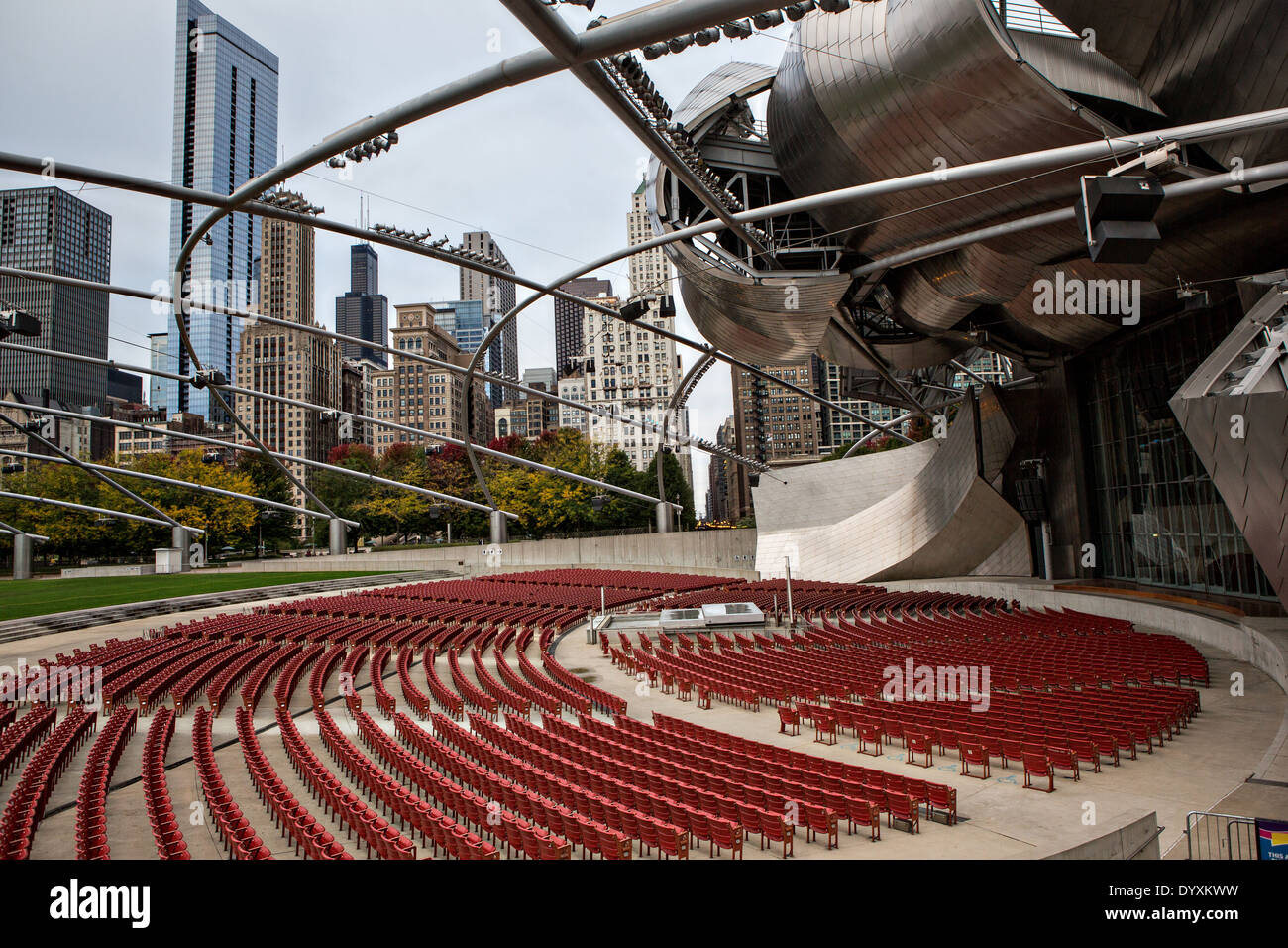 Jay Pritzker Pavilion with downtown skyline at Millennium Park in ...