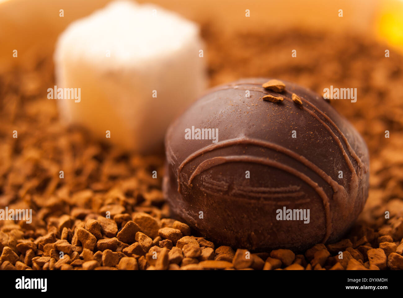 Chocolate candy and sugar cube Stock Photo - Alamy