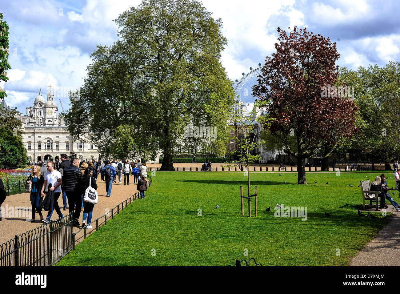 People enjoy a sunny weekend in London, strolling in the park and ...