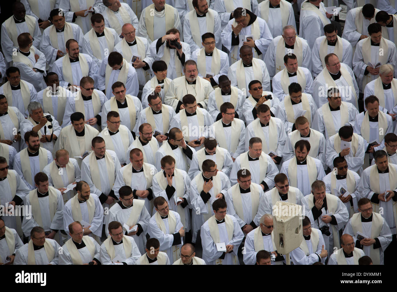 Clerics gather at St. Peter's Square during the historic double ...