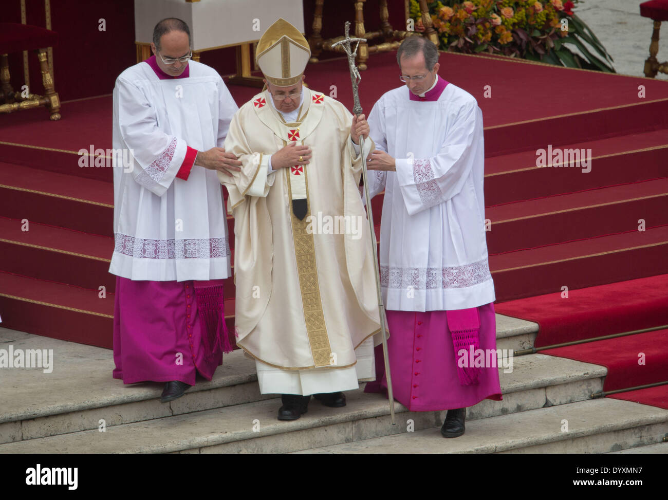 Attendants support Pope Francis after the Canonization Service at St ...