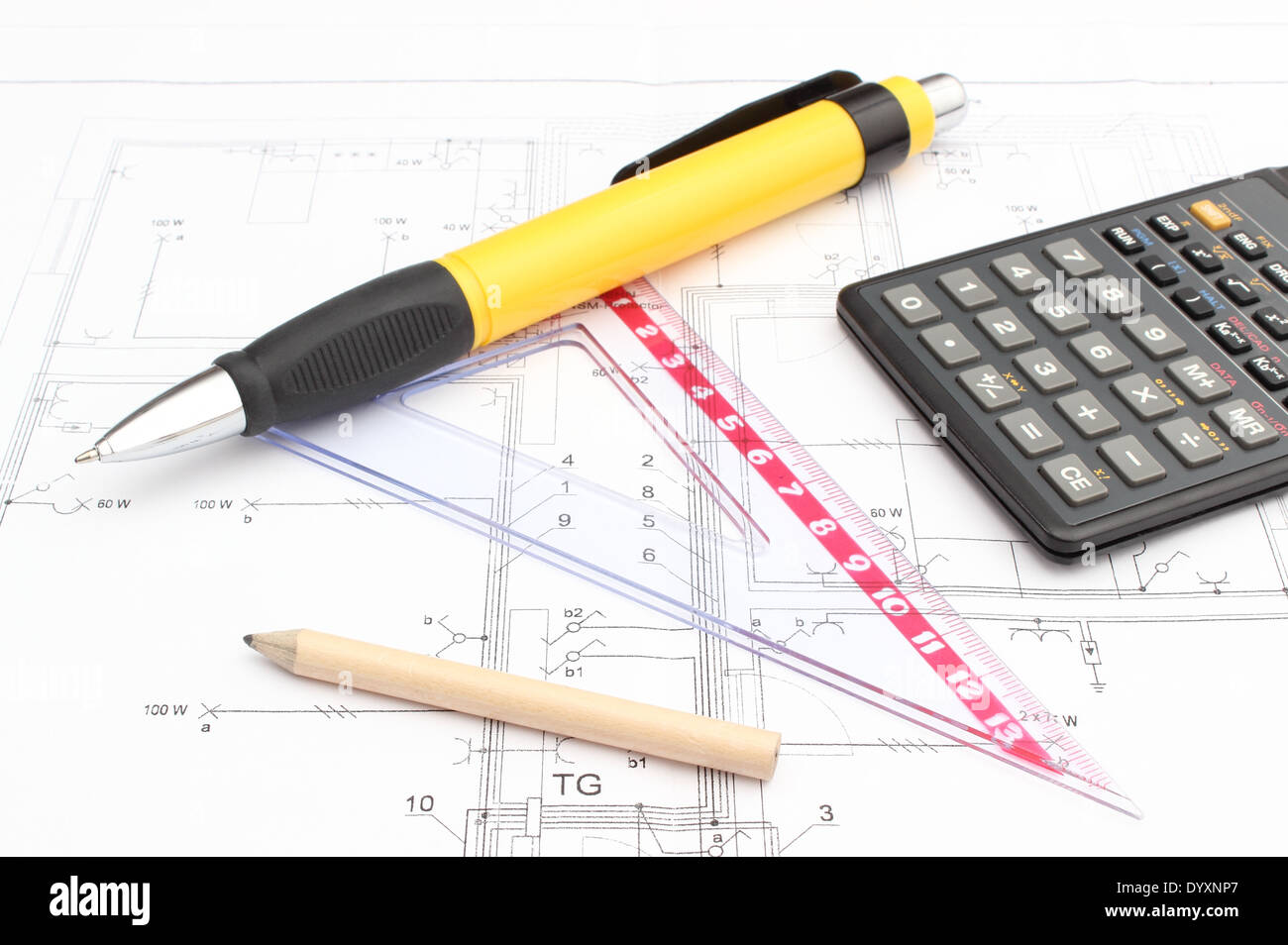 Drawing accessories and calculator on construction drawing of house ...