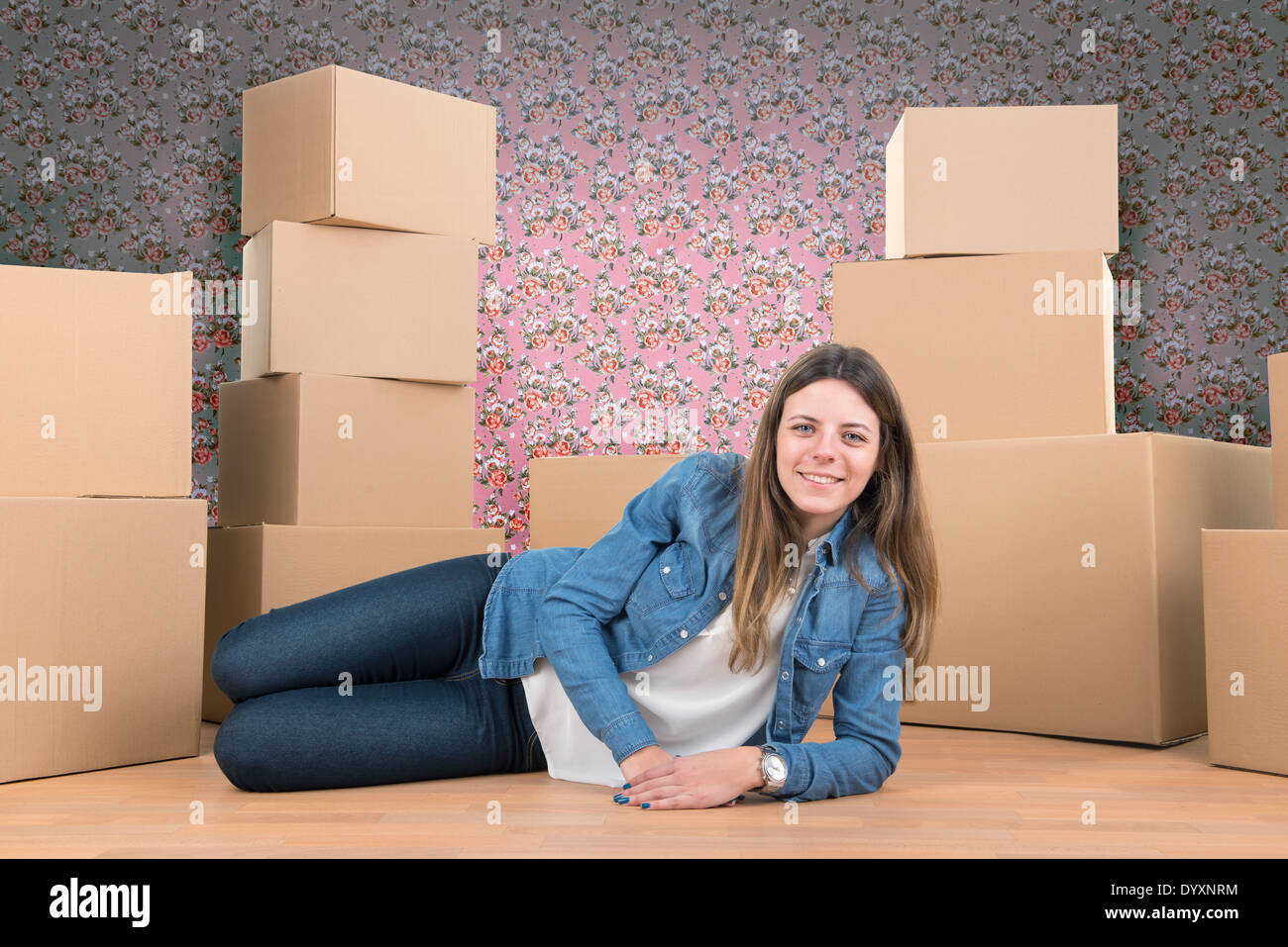 Beautiful girl with cardboard boxes unpacking in new home Stock Photo ...