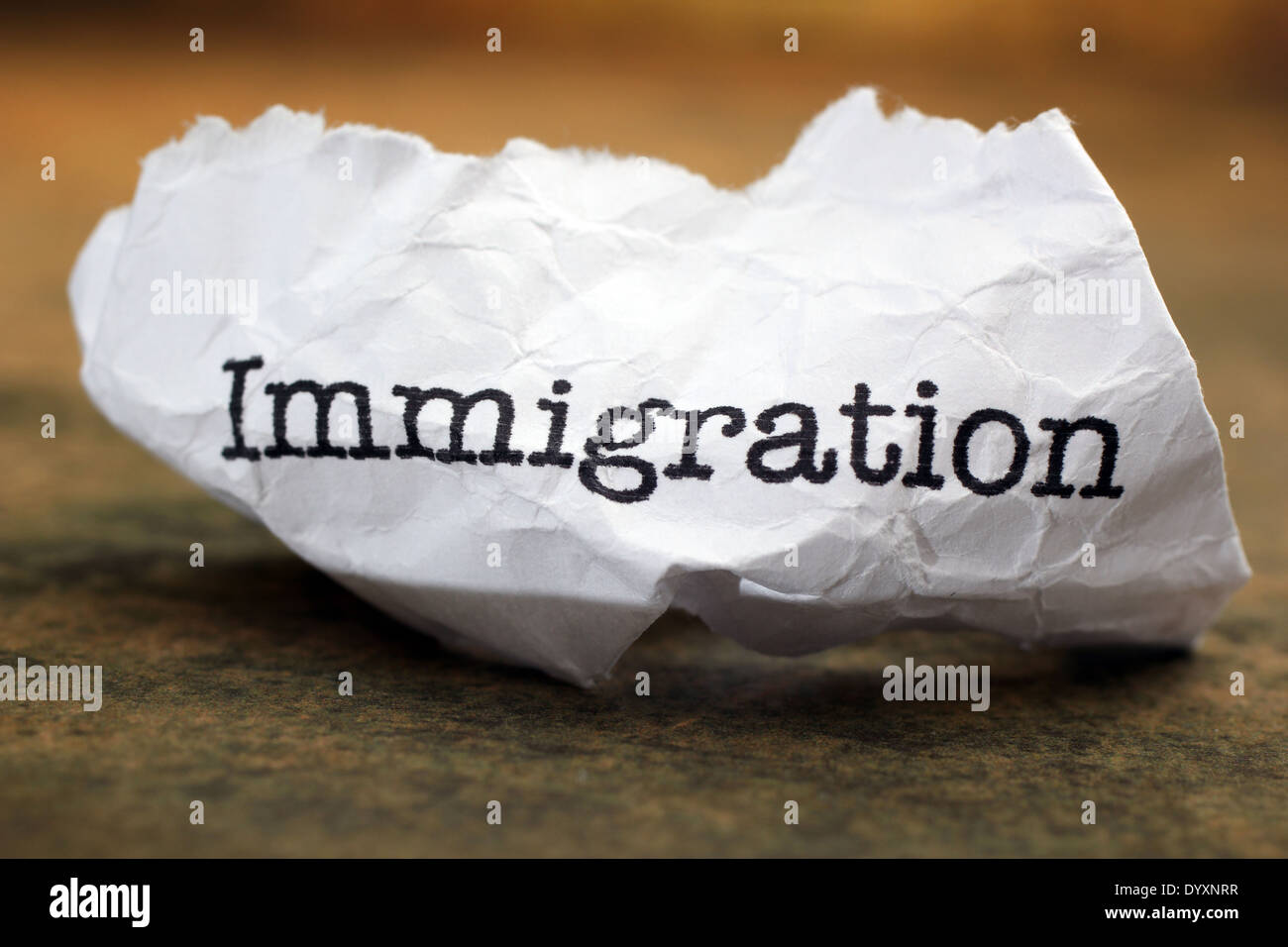 Immigration text on paper Stock Photo - Alamy