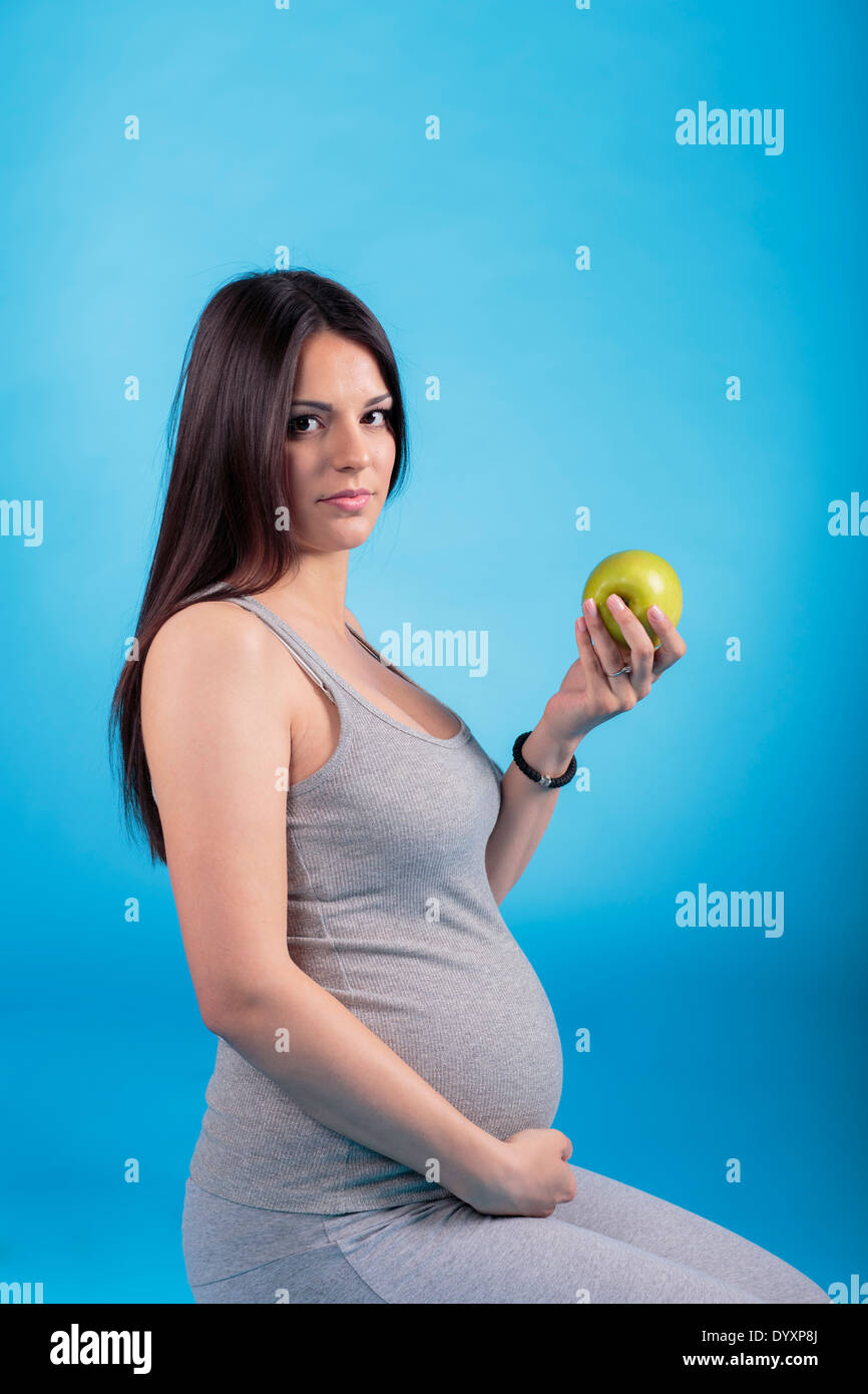 Woman holding apple stomach hi-res stock photography and images - Alamy