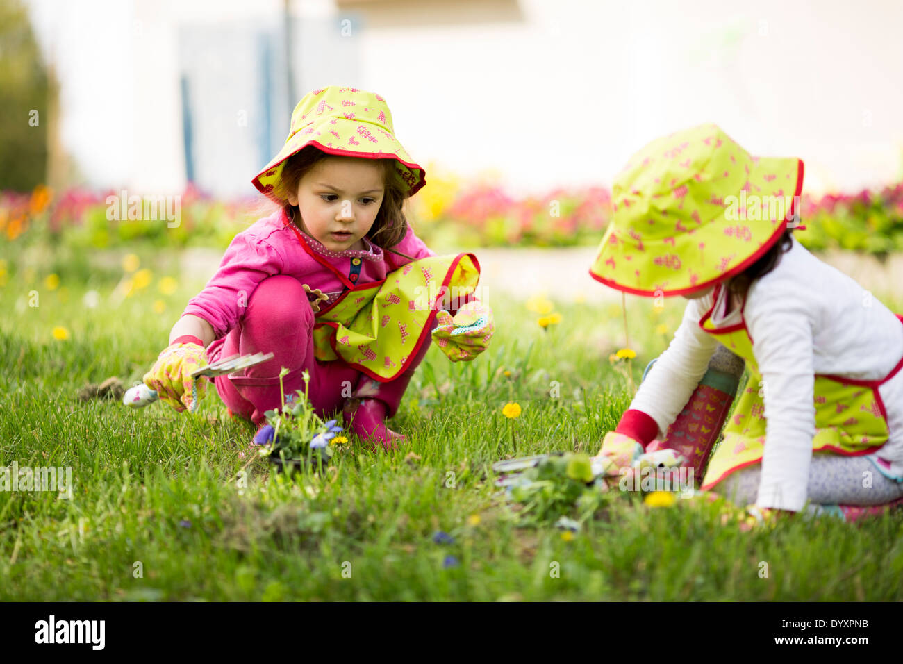 Little girls in the garden Stock Photo - Alamy
