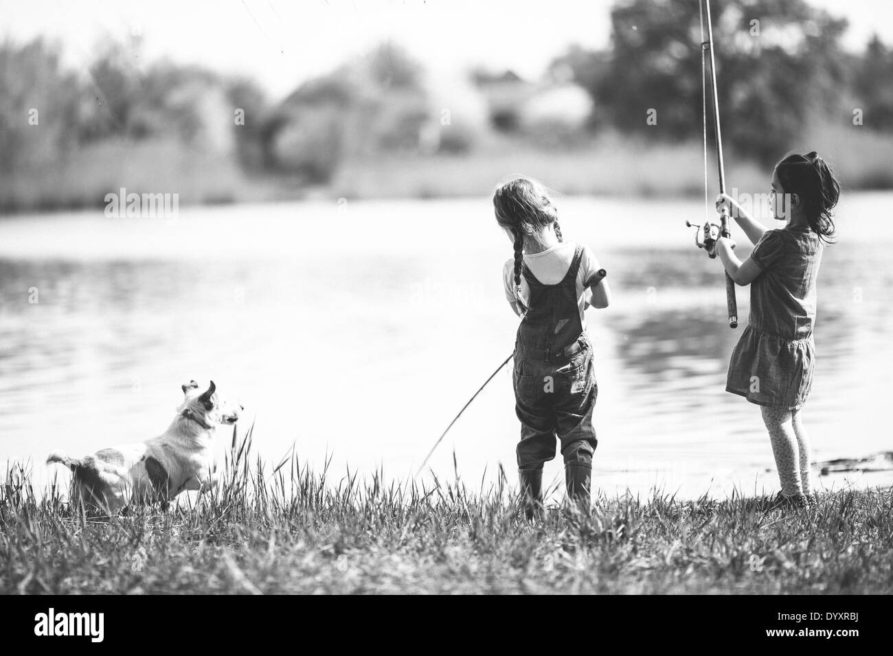 Two little girls fishing Stock Photo - Alamy
