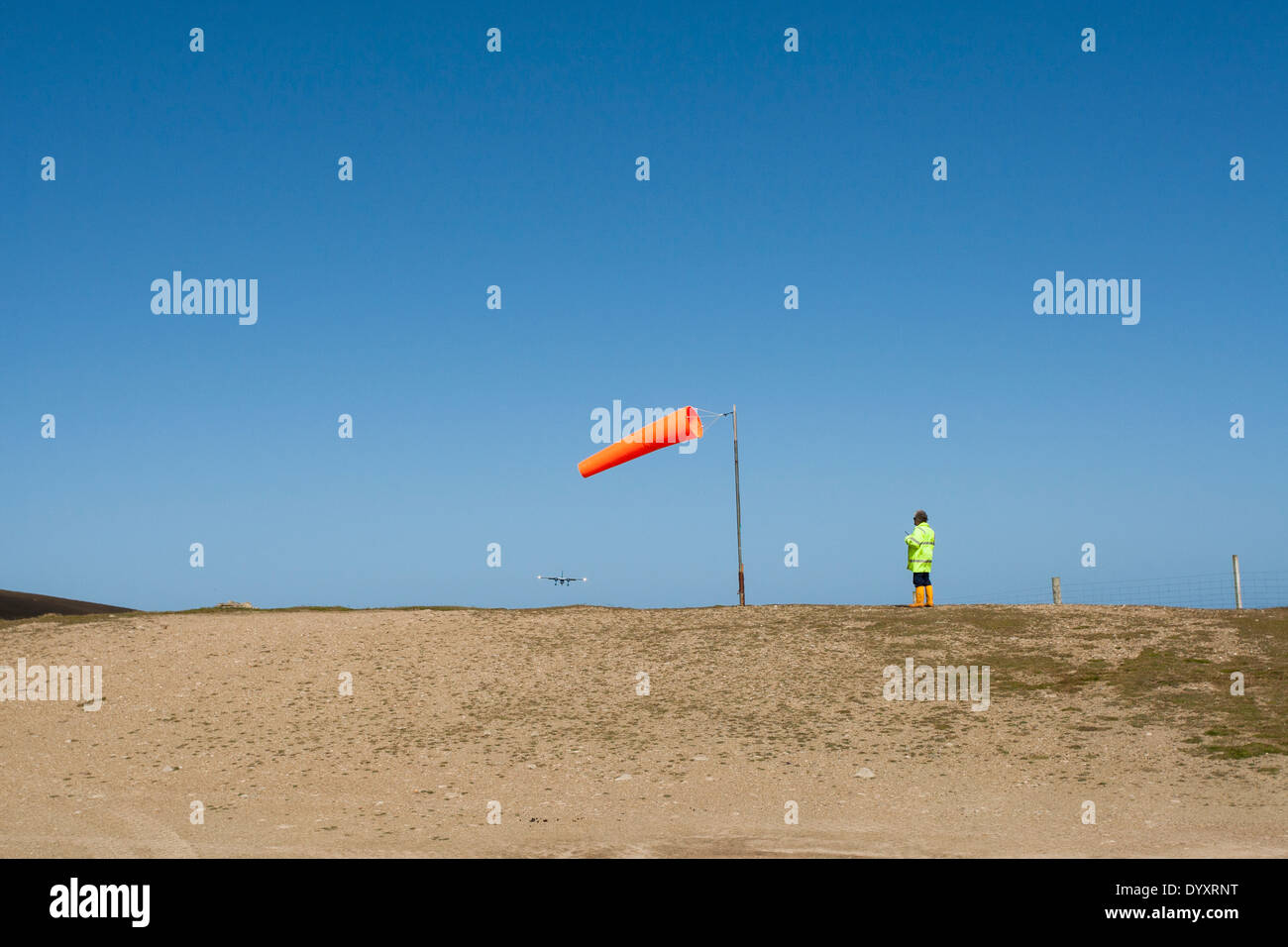 Attendant watching plane arriving at Fair Isle airstrip, Fair Isle ...