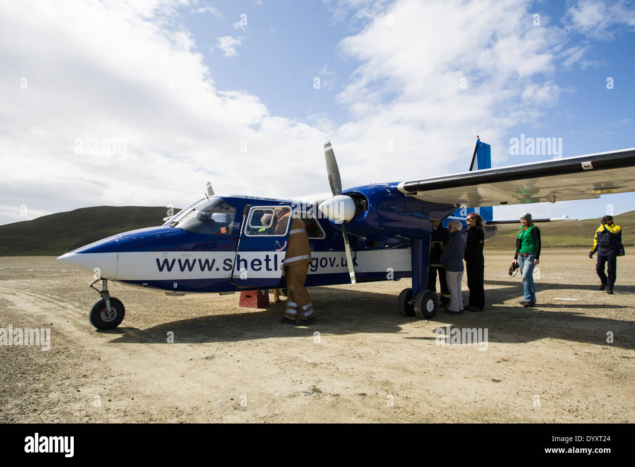 Loading up Direct Flight Islander plane on Fair Isle airstrip, Fair ...