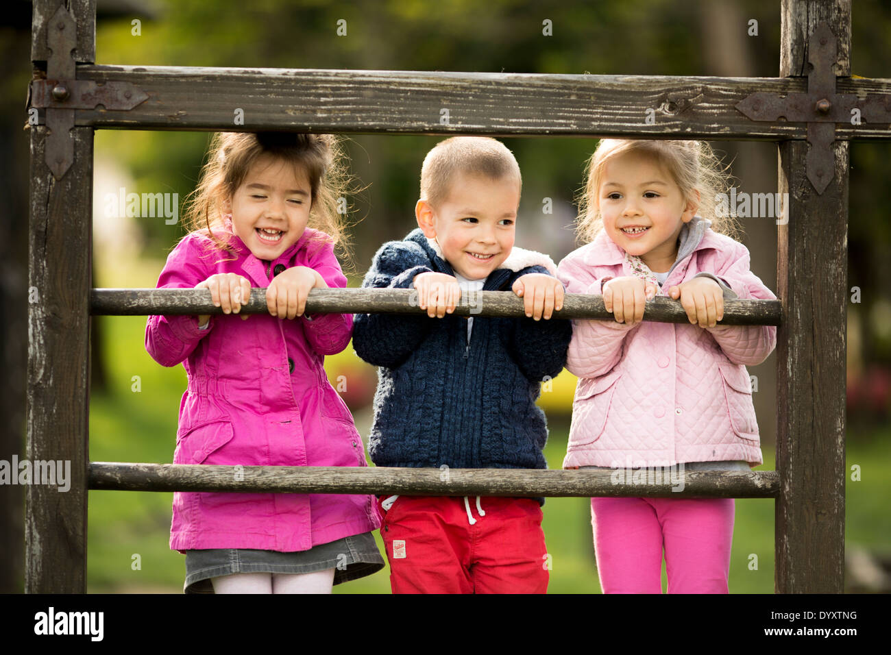 Kids playing at playground Stock Photo - Alamy