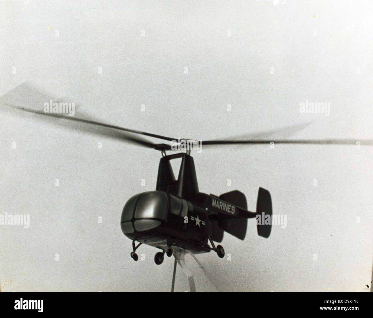 This image features a model of the Kaman Husky helicopter, known for ...