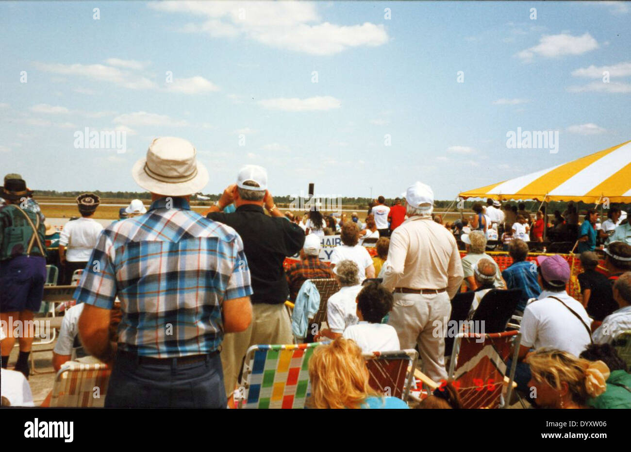 This photo captures spectators at a public event in 1996, documenting ...