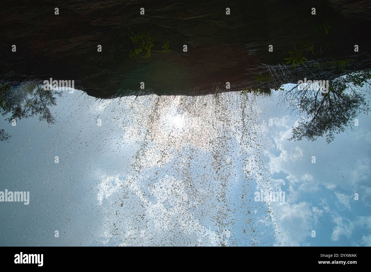 Waterfall with sky from below Stock Photo - Alamy