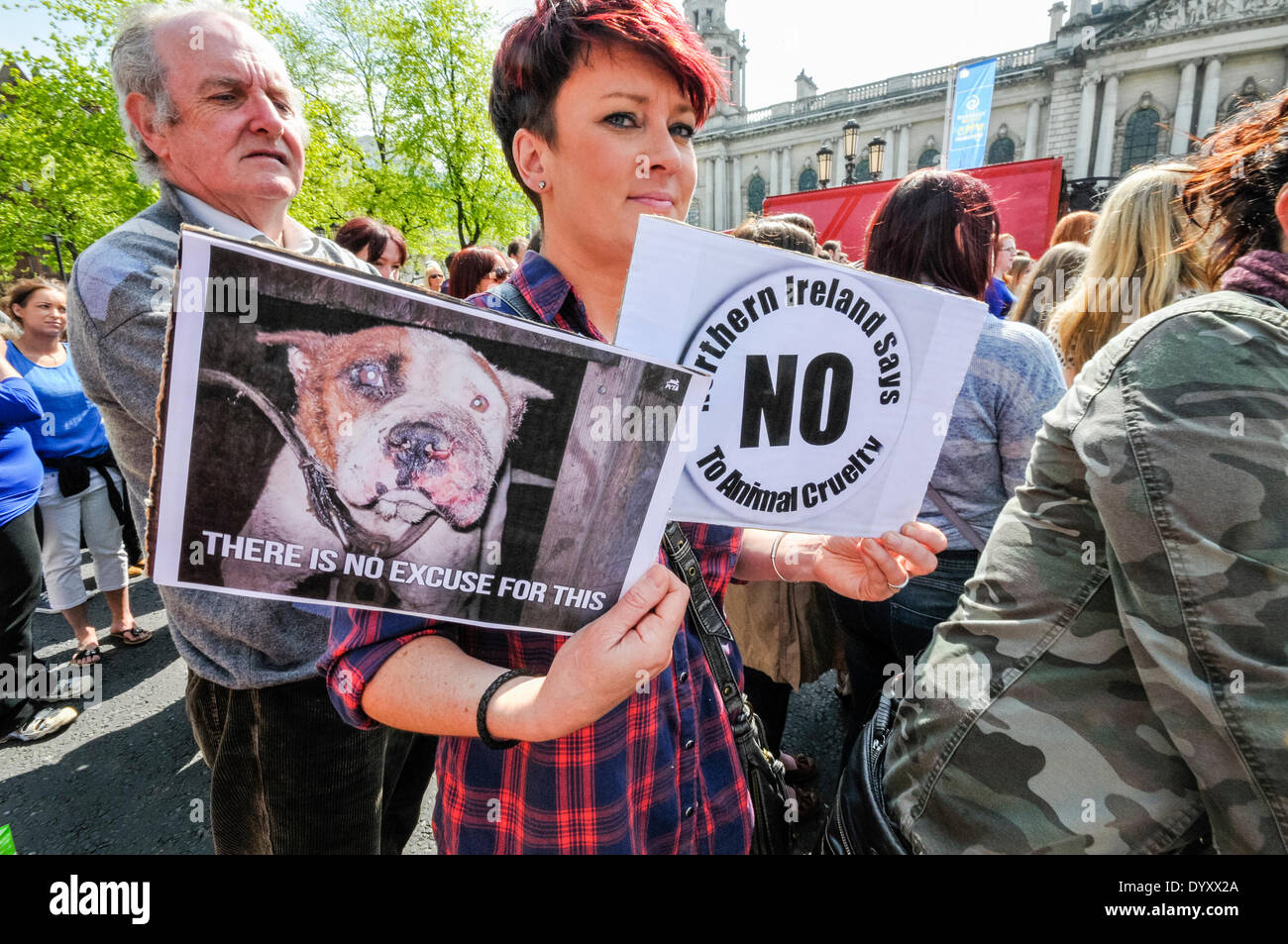 Belfast, Northern Ireland. 27 Apr 2014 - A woman holds two protest ...