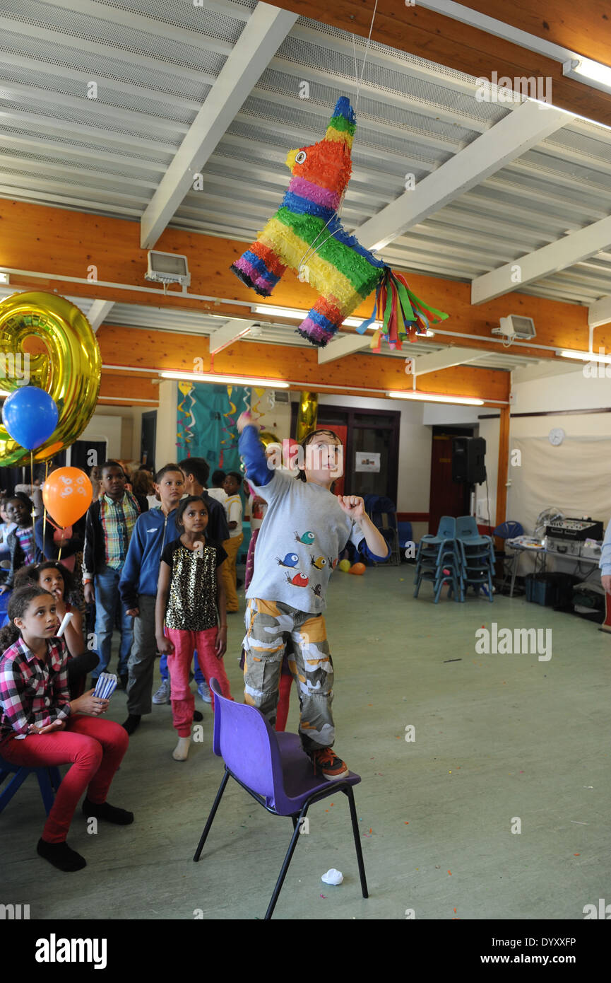 pinata being smashed at a 9th birthday party in London Stock Photo - Alamy