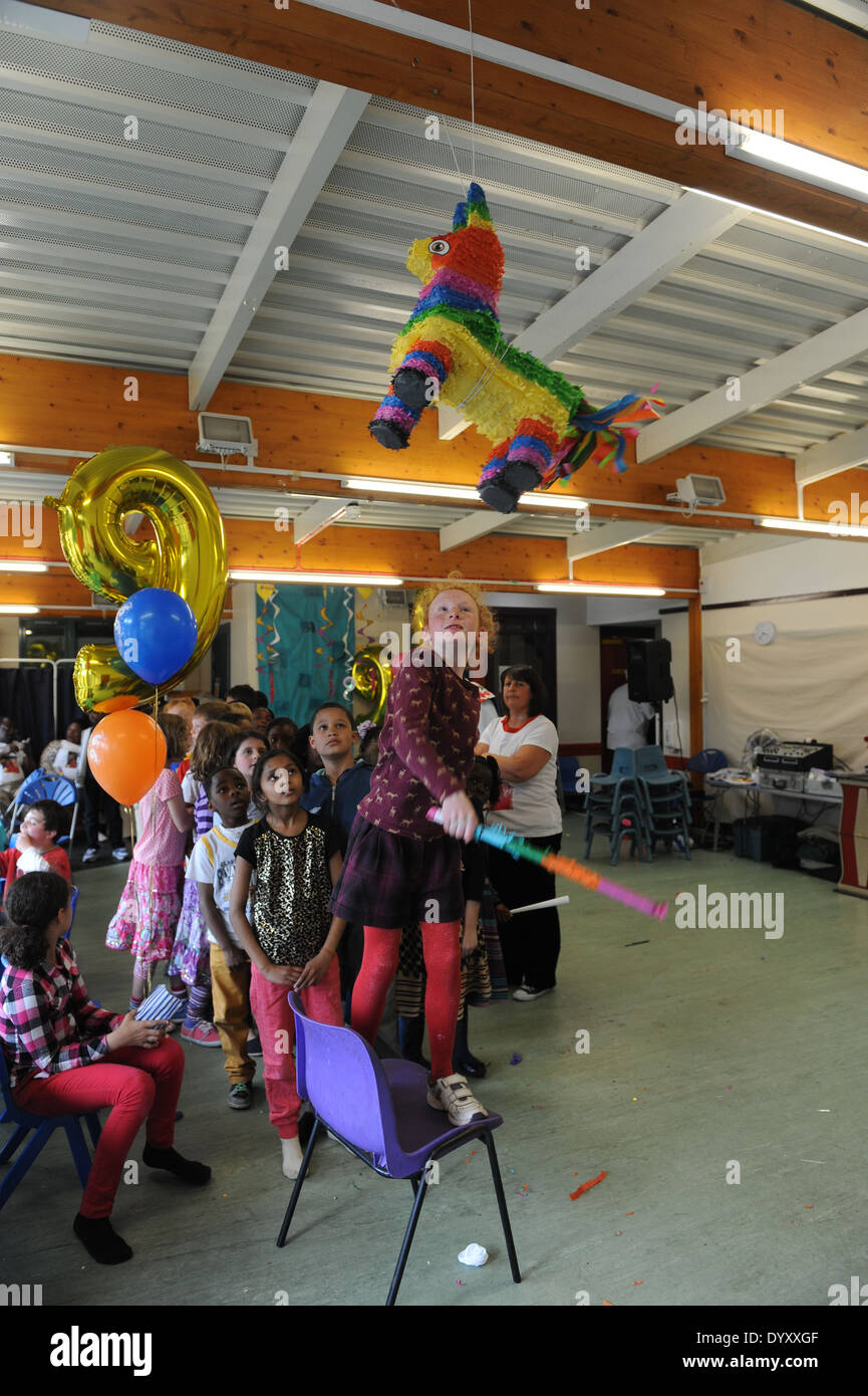pinata being smashed at a 9th birthday party in London Stock Photo - Alamy