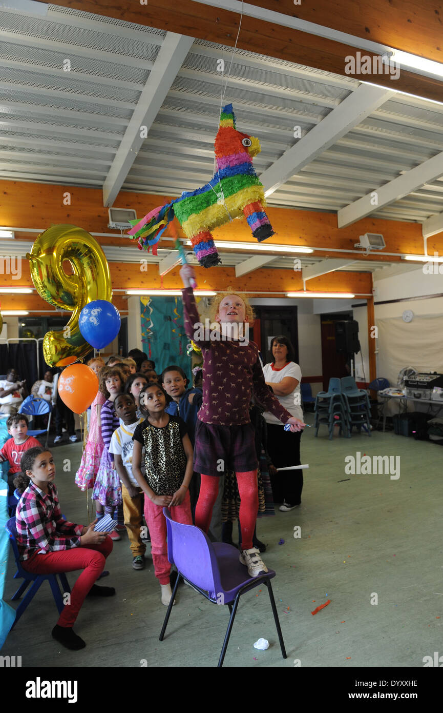 pinata being smashed at a 9th birthday party in London Stock Photo - Alamy