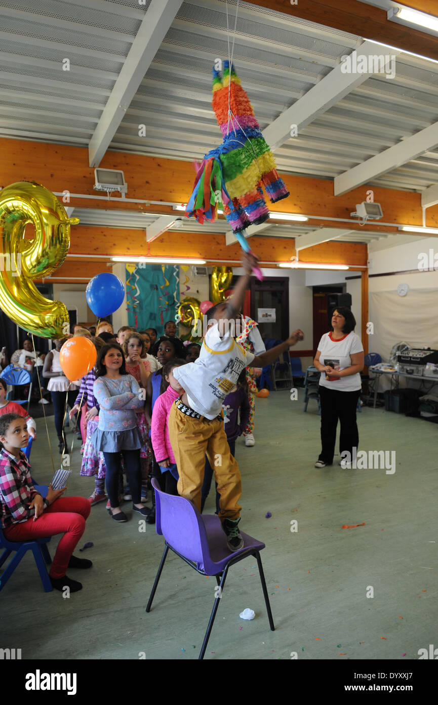 pinata being smashed at a 9th birthday party in London Stock Photo - Alamy