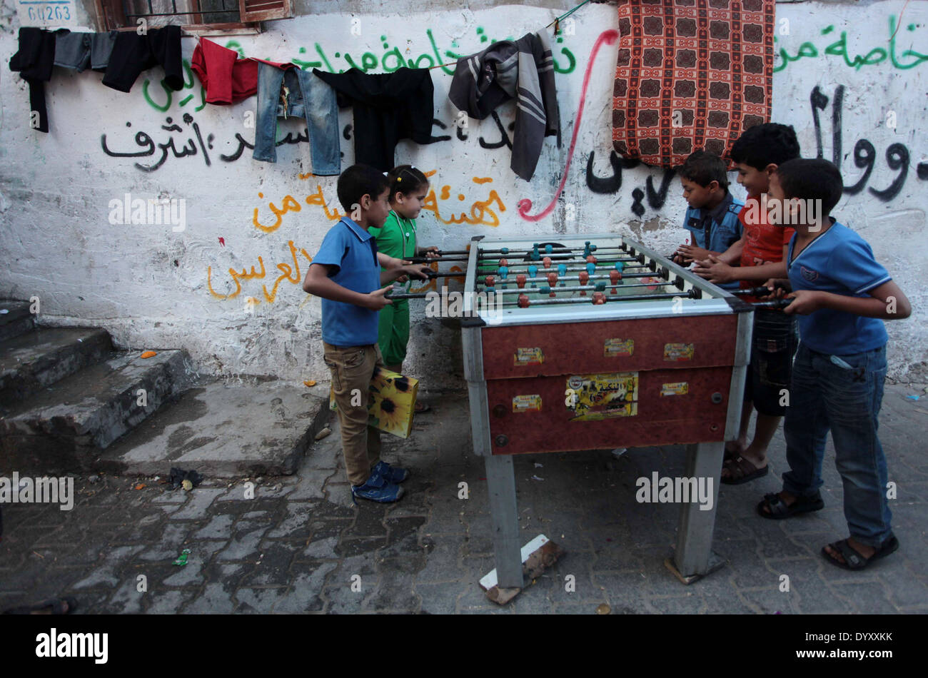 Palestinian children play football in hi-res stock photography and ...