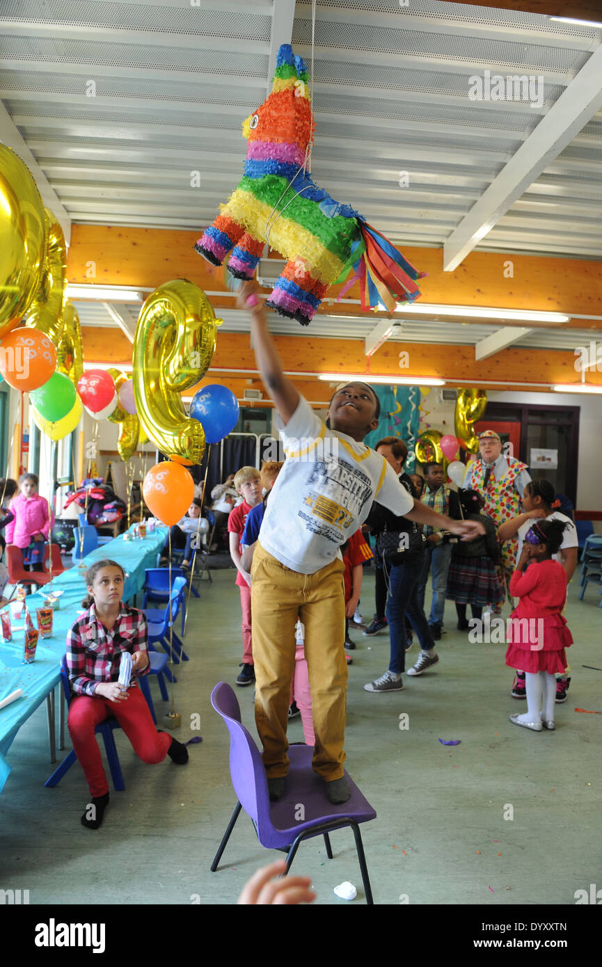 pinata being smashed at a 9th birthday party in London Stock Photo - Alamy