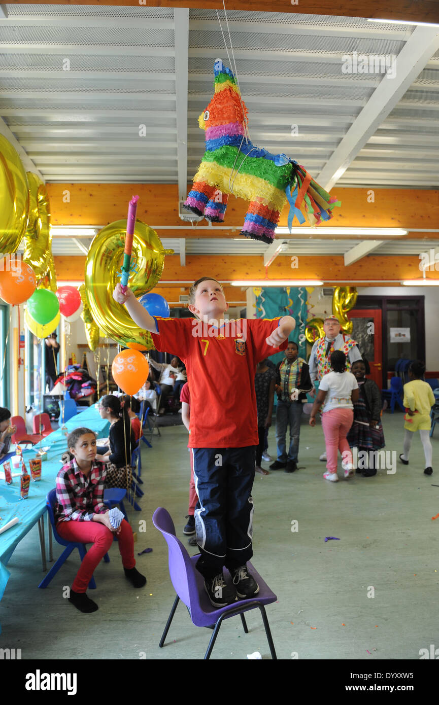 pinata being smashed at a 9th birthday party in London Stock Photo - Alamy