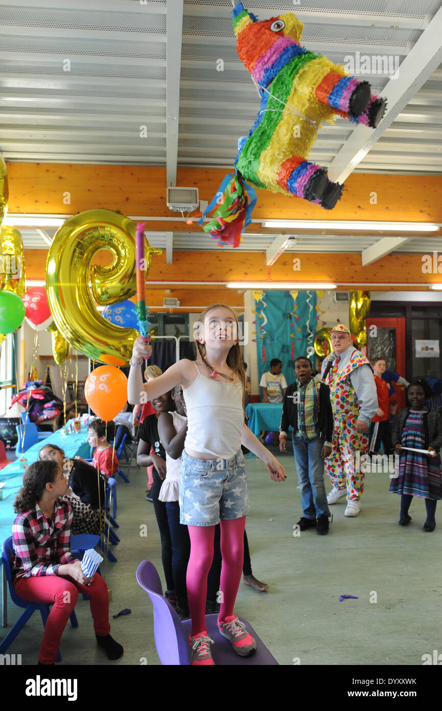 pinata being smashed at a 9th birthday party in London Stock Photo - Alamy