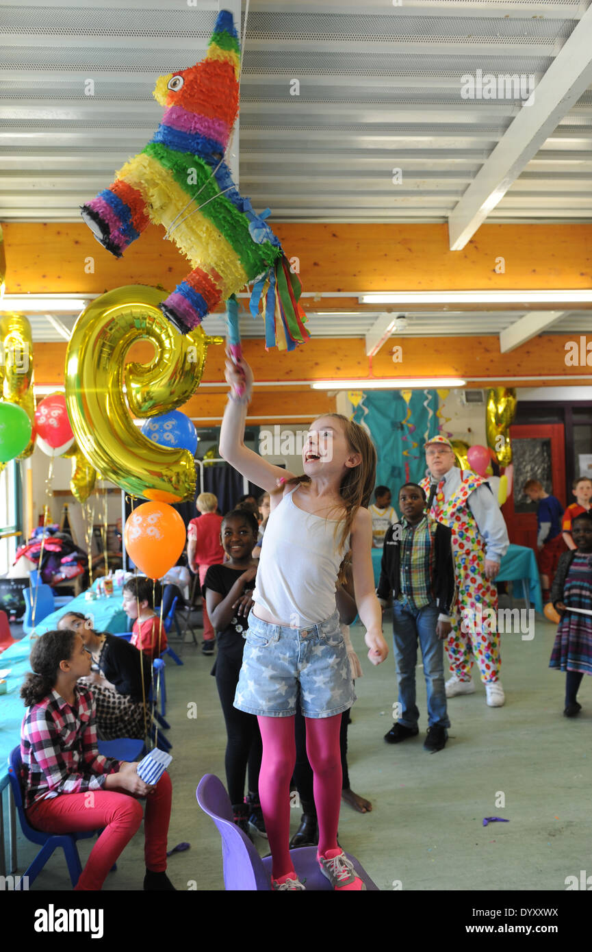 pinata being smashed at a 9th birthday party in London Stock Photo - Alamy