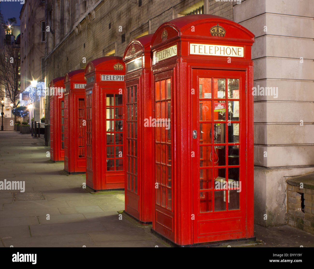 Row of red K2 telephone boxes at night Covent Garden London England UK ...