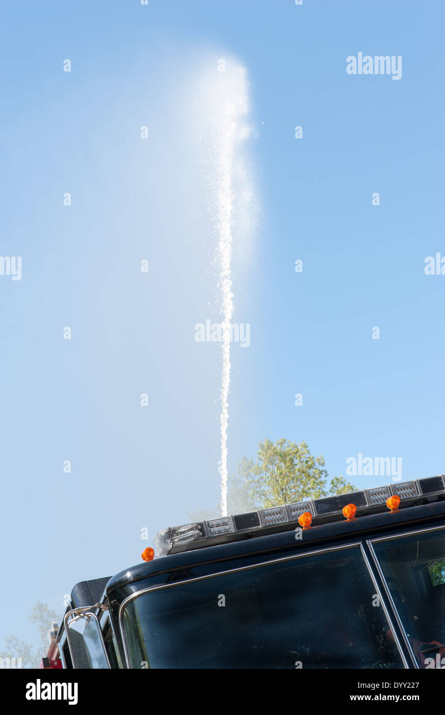 Fire engine water cannon in use during a training event Stock Photo - Alamy
