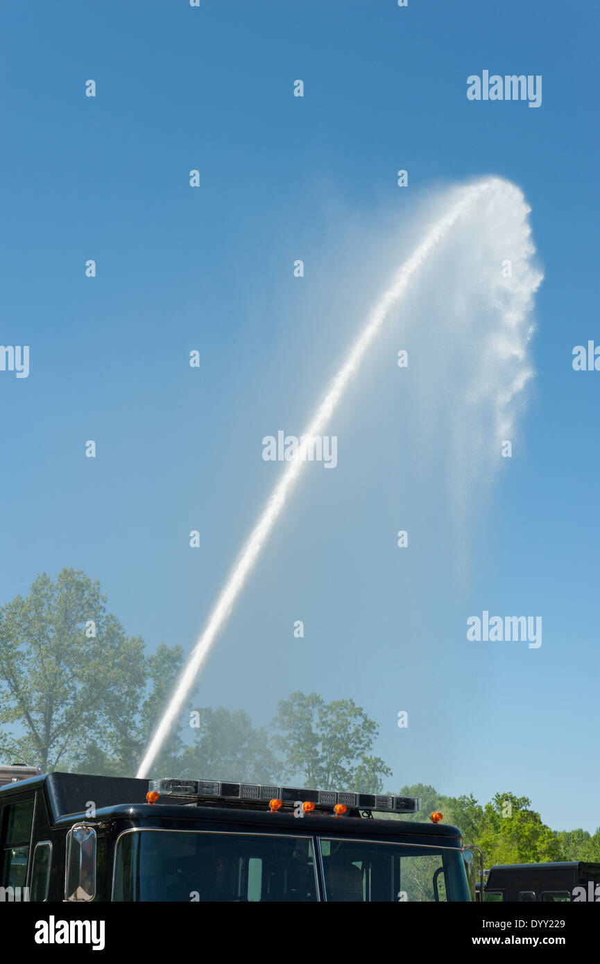 Fire engine water cannon in use during a training event Stock Photo - Alamy