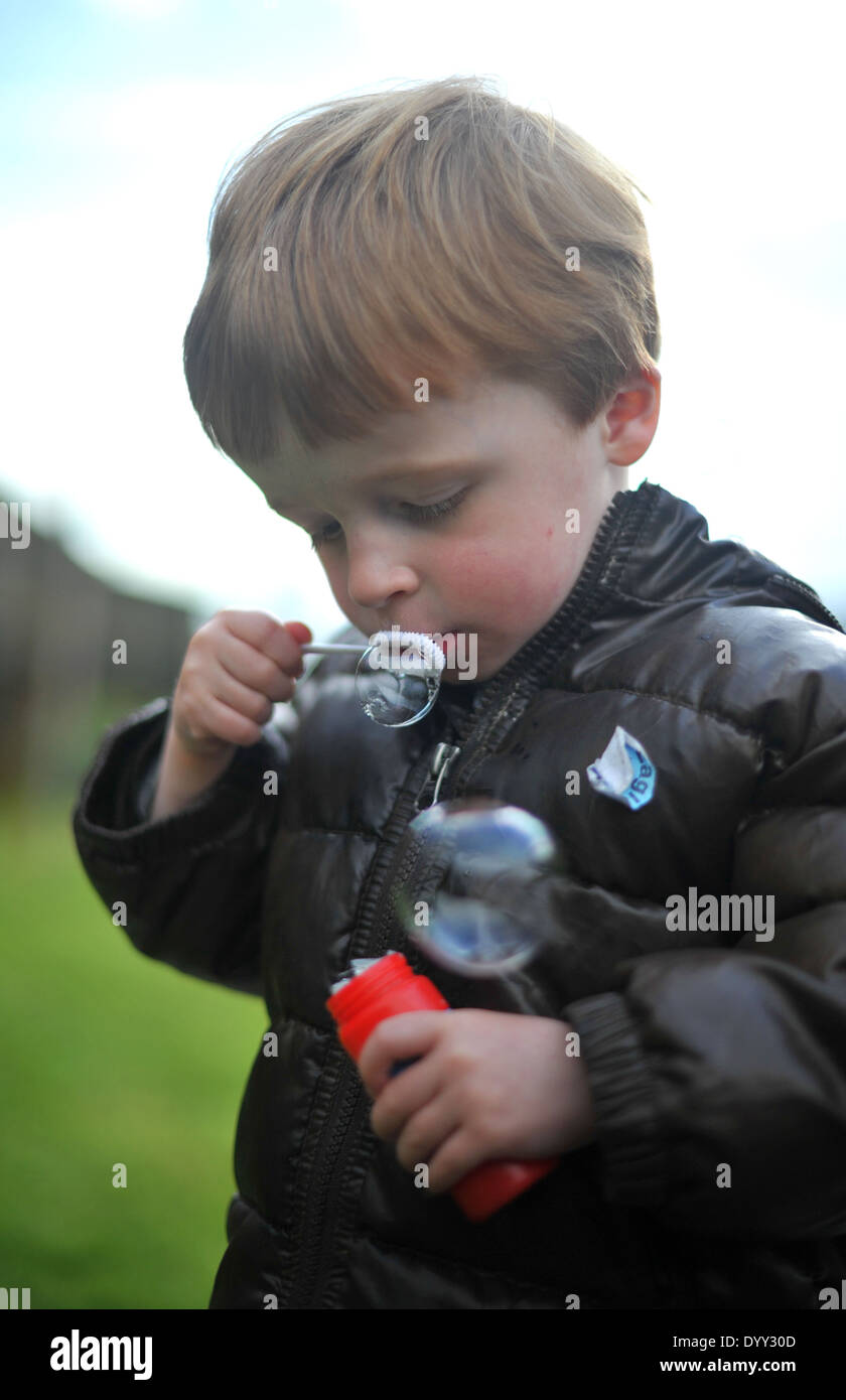 Year old boy blowing bubbles hi-res stock photography and images - Alamy
