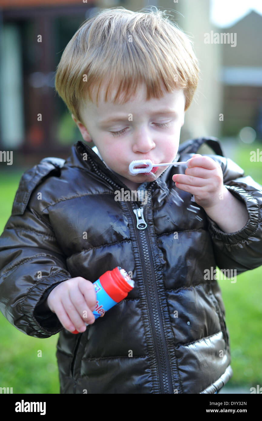 Boy blowing bubbles hi-res stock photography and images - Alamy