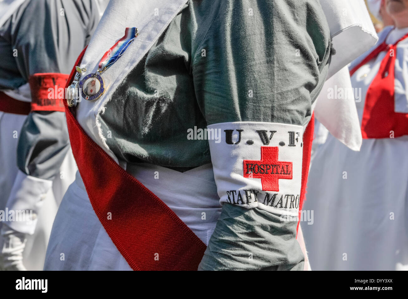 Woman wearing a nurses uniform from WW1, and wears an armband saying ...